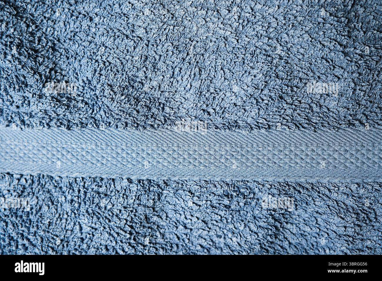 The gentle texture of blue fabric offers a sense of calm and comfort ...