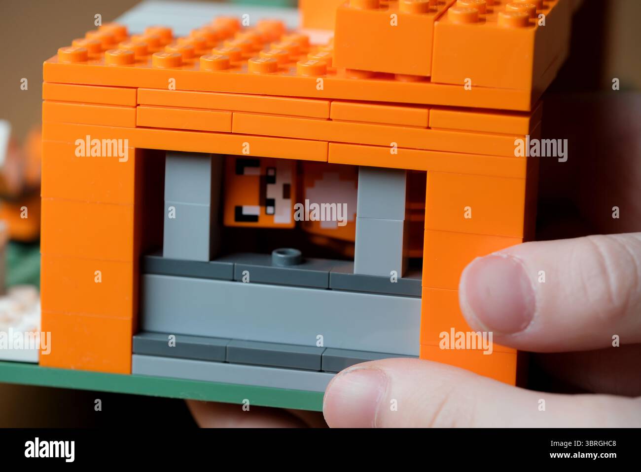 A creative construction showcases a vibrant orange building with ...