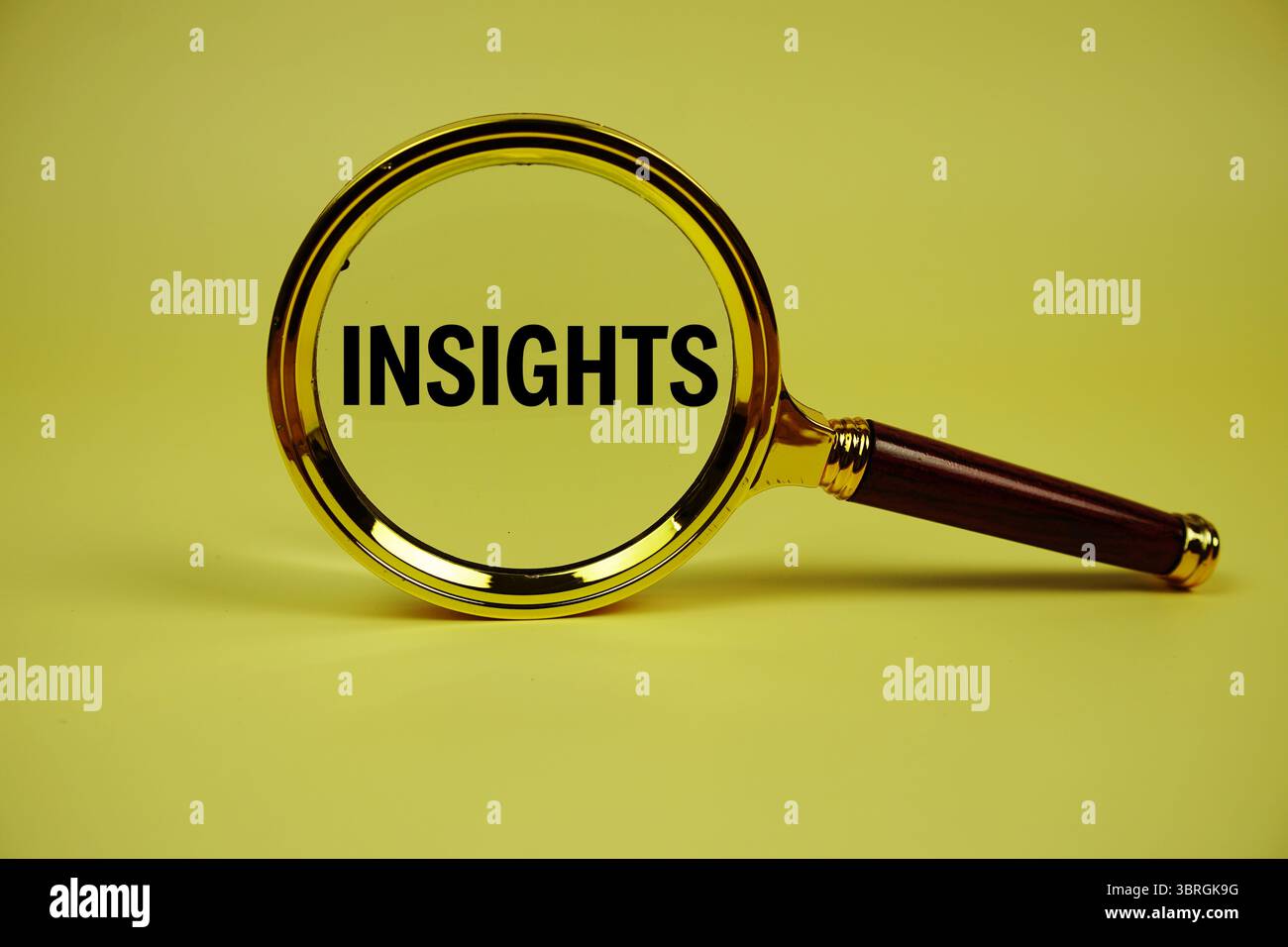 Insights text with magnifying glass on yellow background Stock Photo ...