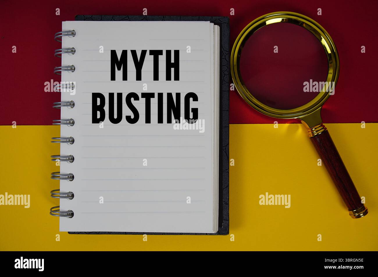 Myth Busting text written on notebook paper with magnifying glass Stock ...
