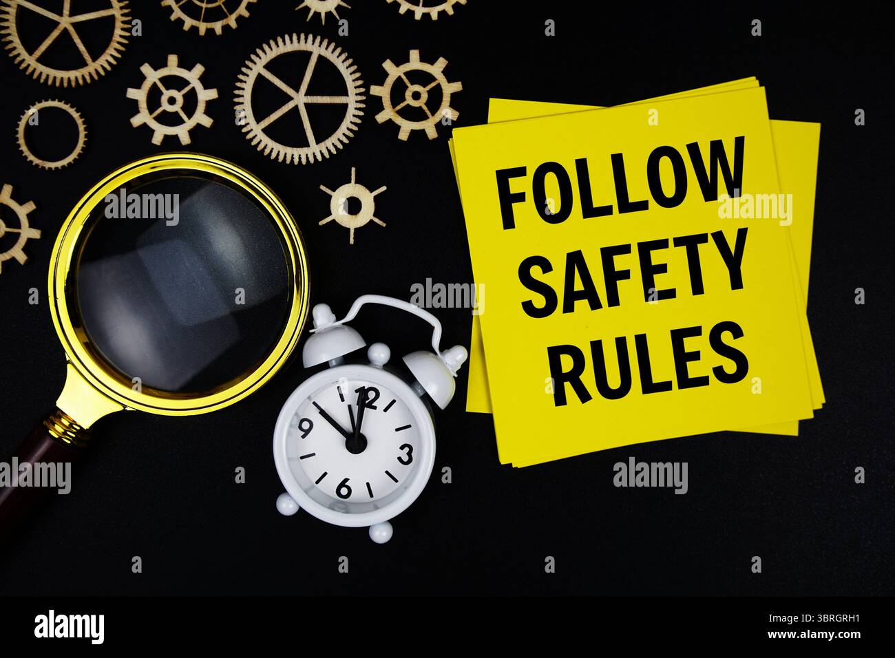 Follow Safety Rules text message on sticky note with magnifying glass ...