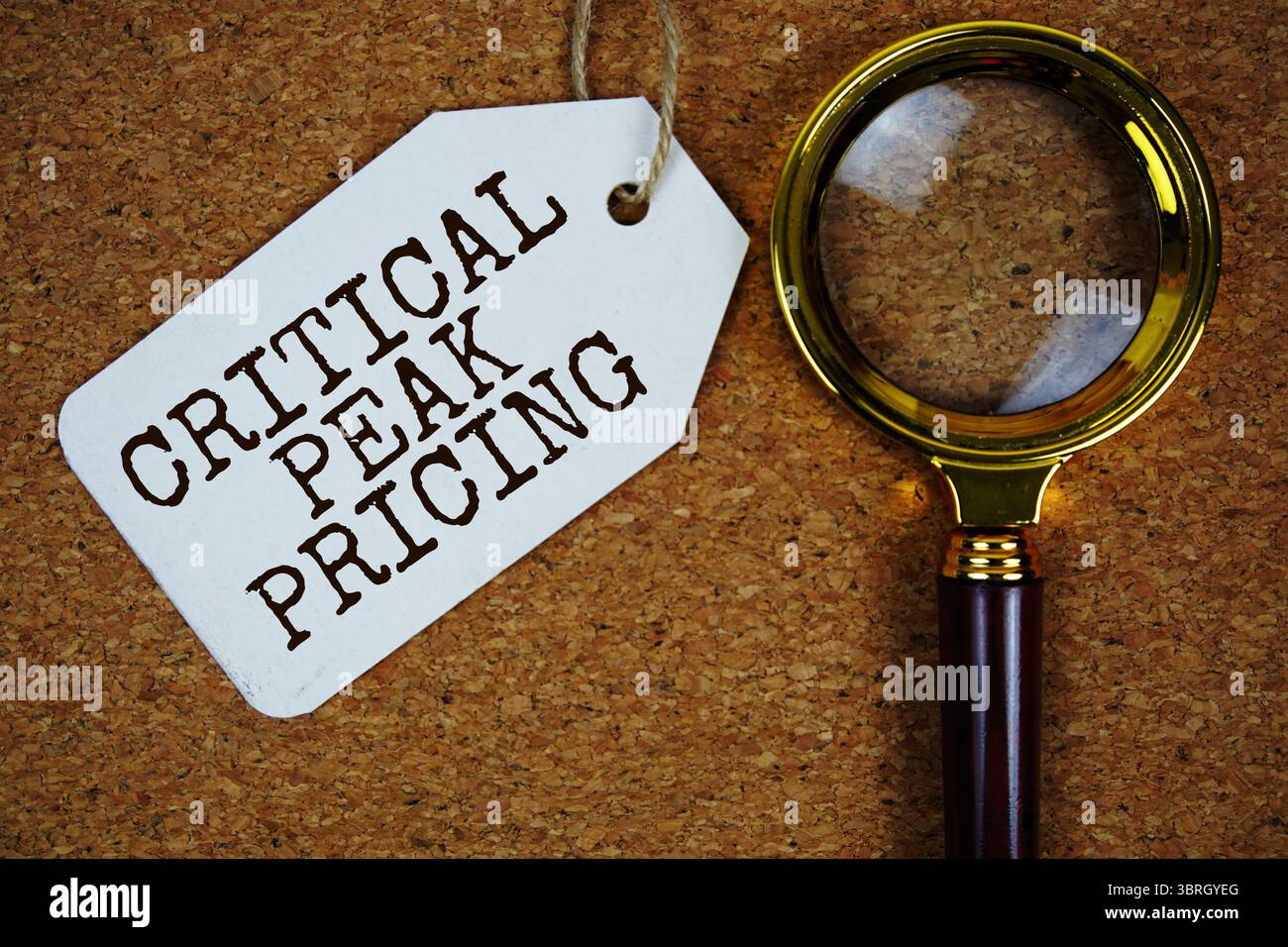 Critical Peak Pricing text on price tag with magnifying glass on cork ...