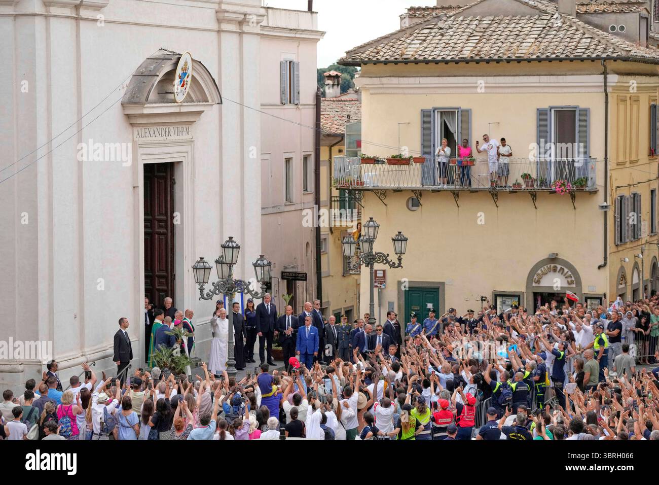 Pope Leo XIV waves to faithful as he arrives to celebrate a mass inside ...