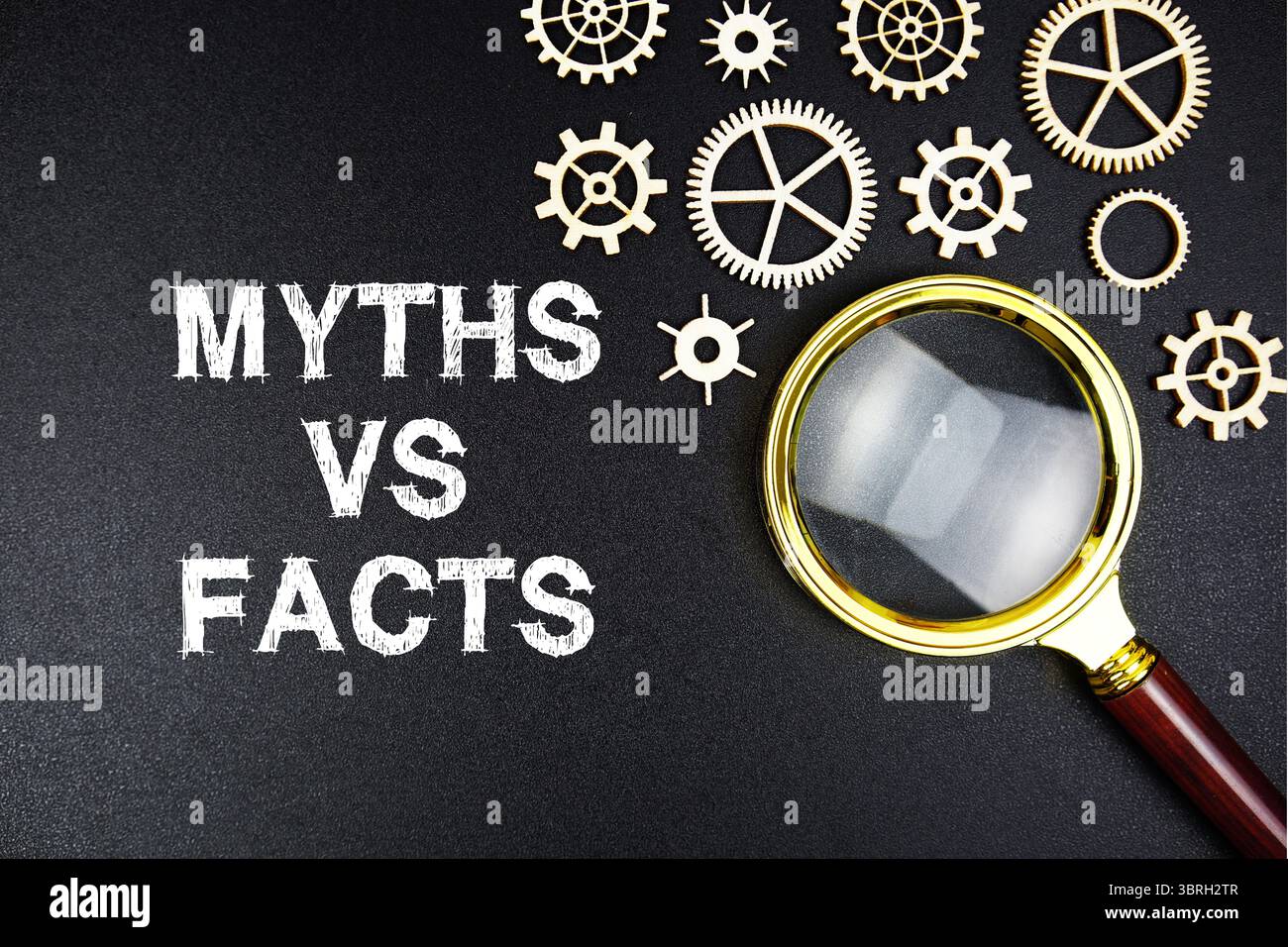Myths vs Facts text message with magnifying glass on black background ...