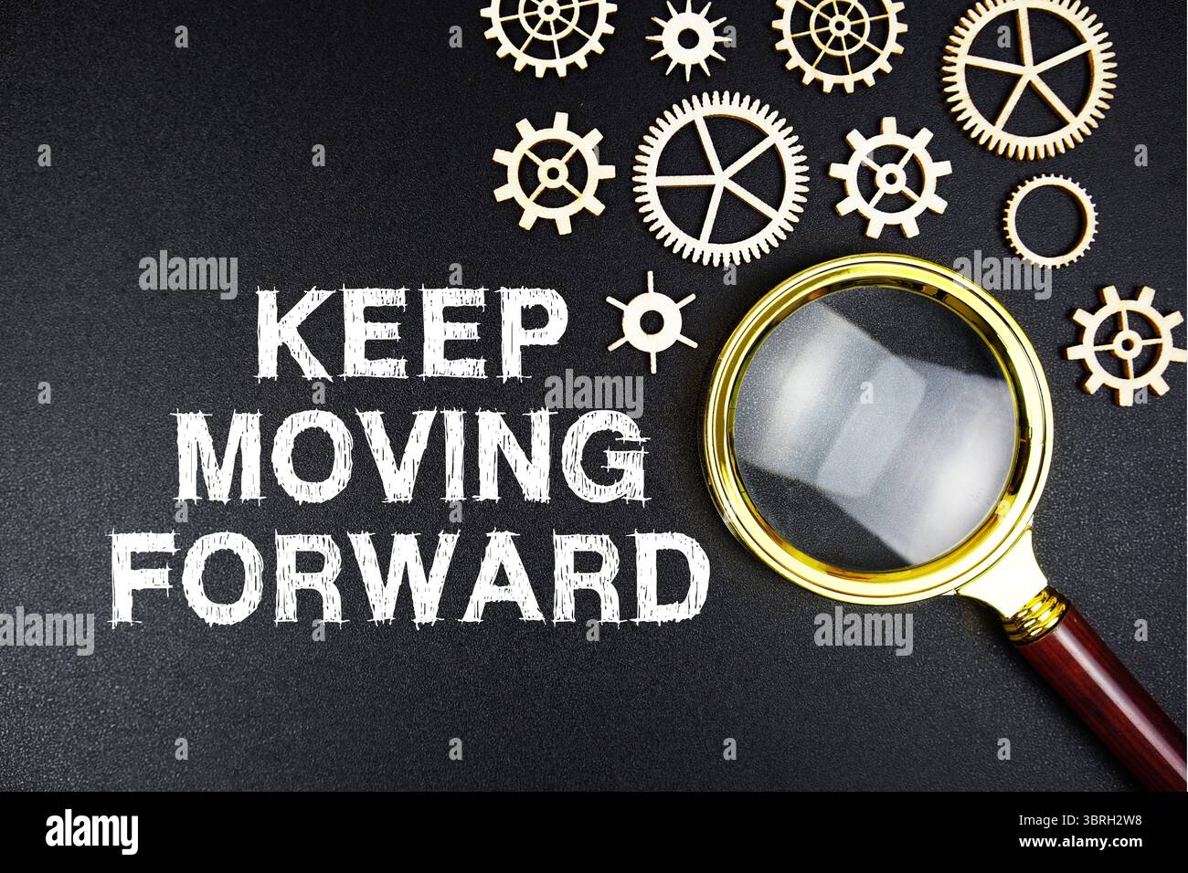 Keep Moving Forward text message with magnifying glass on black ...