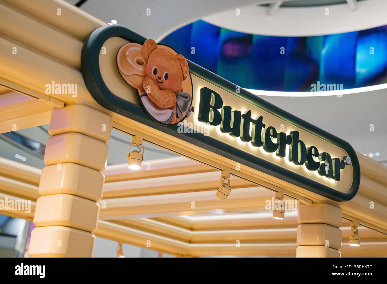 A display panel featuring Butterbear stands in the pastry and merchandise section of the shop ...