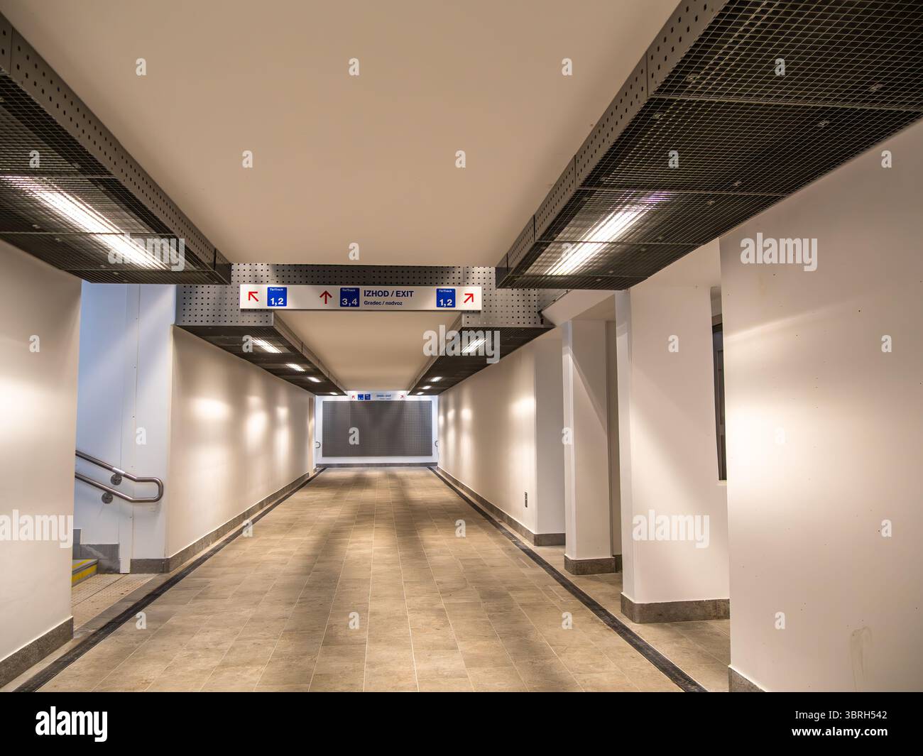 Modern underground corridor with directional signs and lighting Stock ...