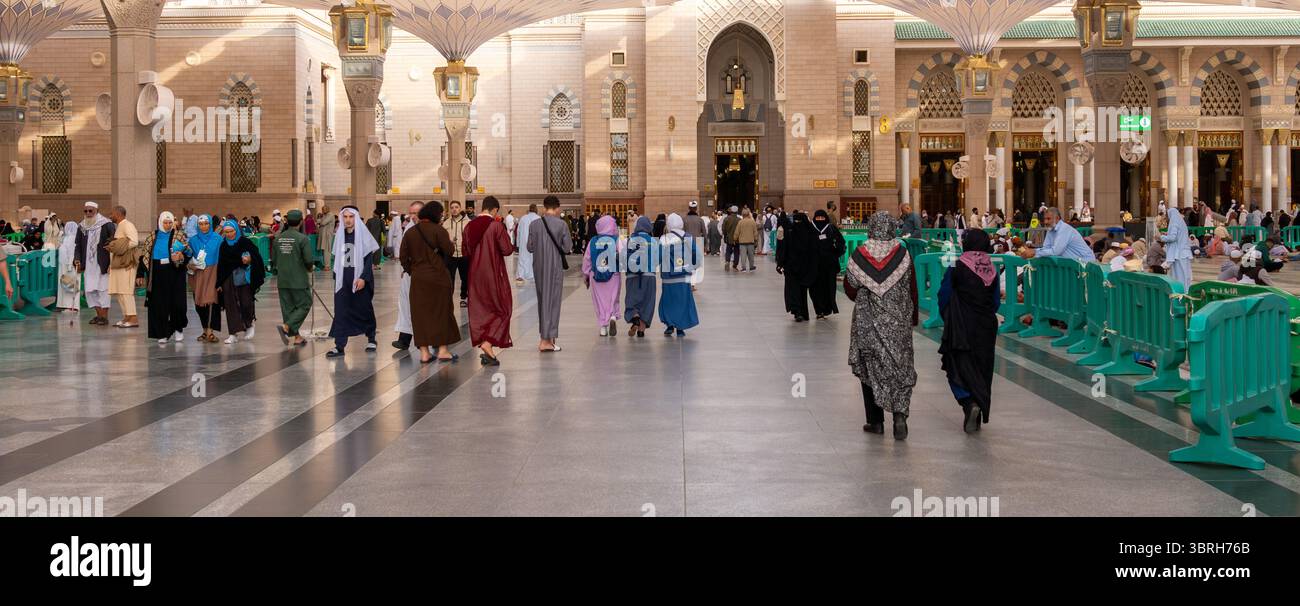 Medina, Saudi Arabia - December 18, 2024: Pilgrims under giant ...