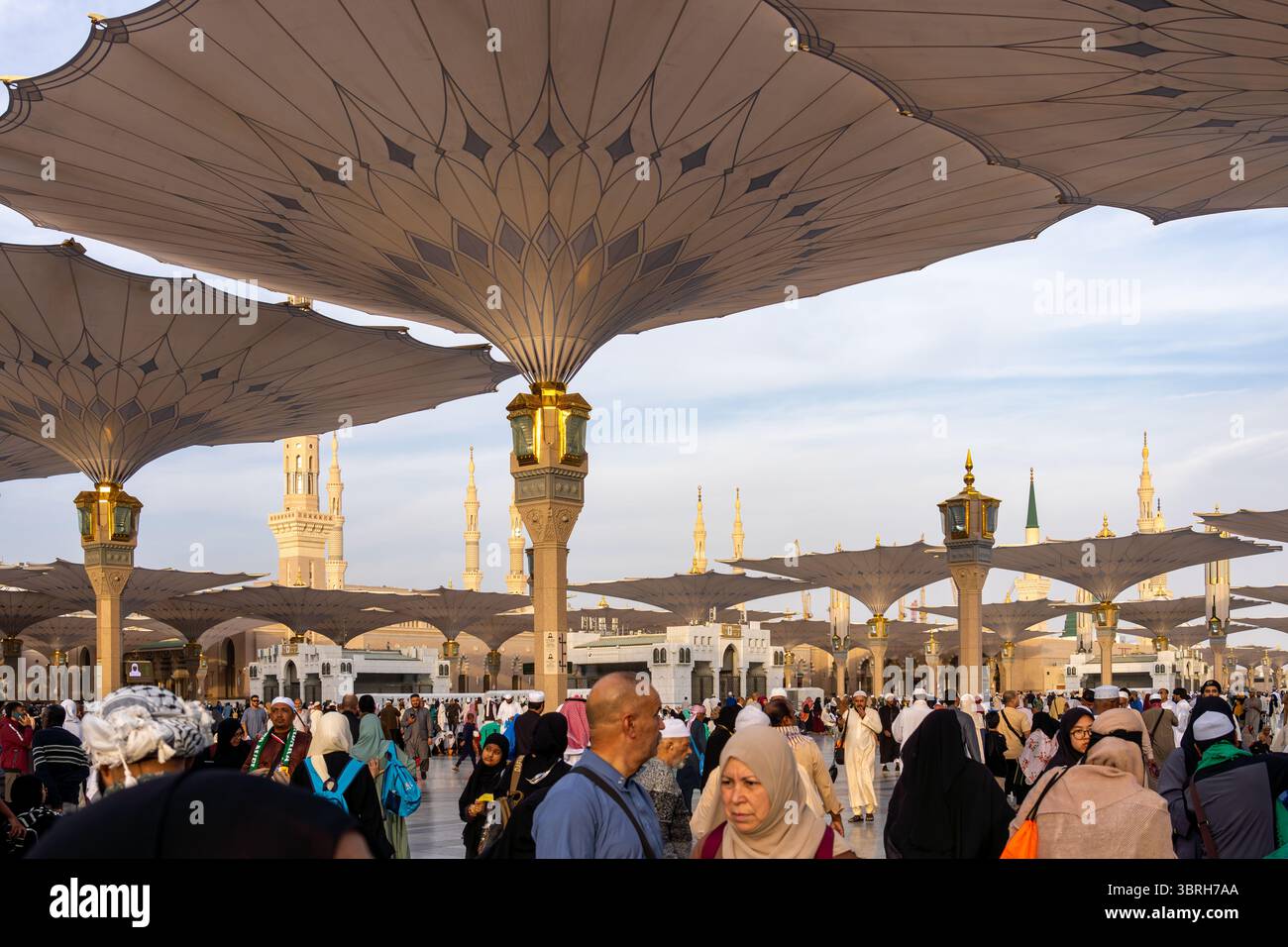 Medina, Saudi Arabia - December 18, 2024: Pilgrims under giant ...