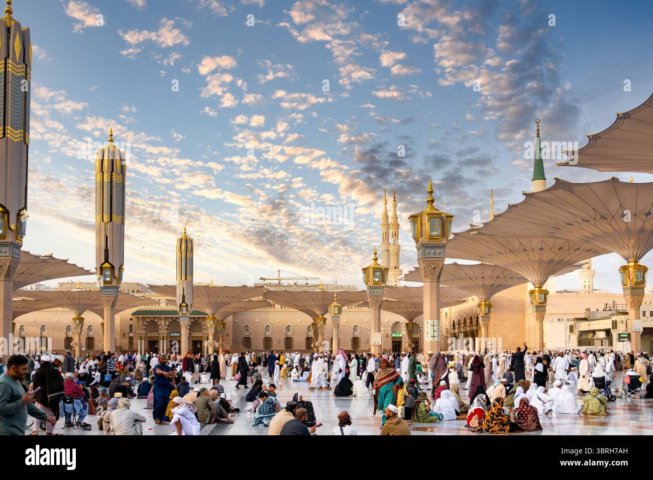 Medina, Saudi Arabia - December 18, 2024: Pilgrims under giant ...