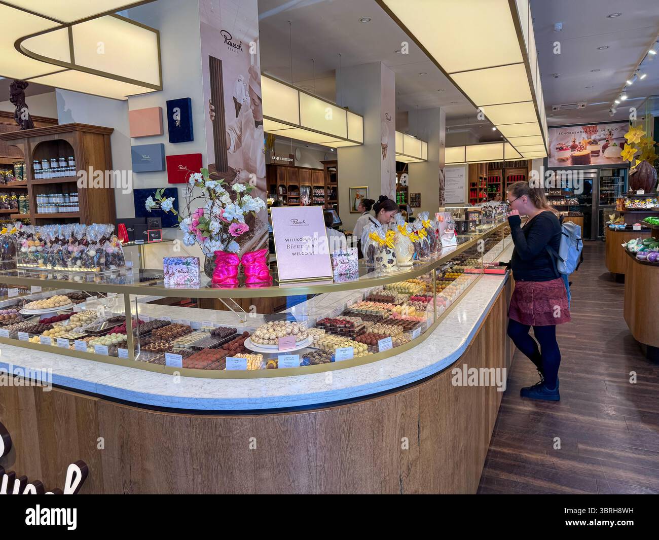 A woman customer in the traditional Rausch Schokoladenhaus chocolate ...