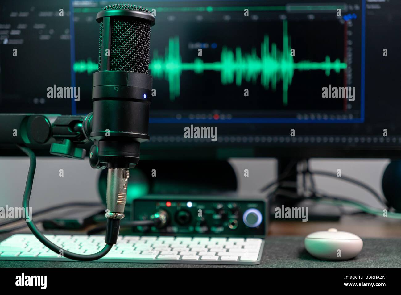 A sleek black studio microphone is prominently featured, set against a ...