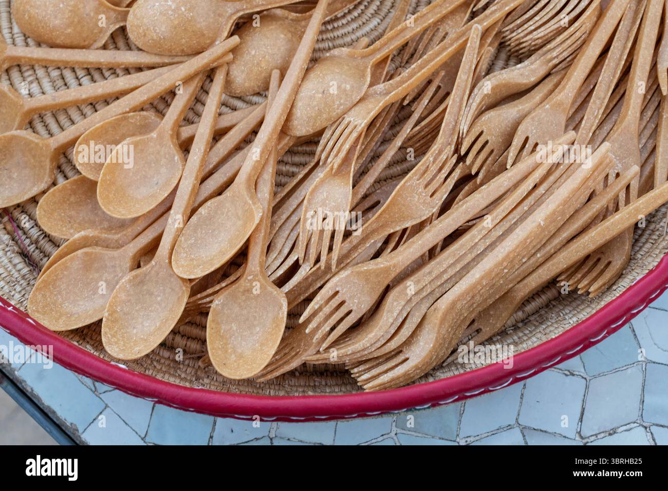 Non-plastic, biodegradeable, single-use spoons and forks set out for ...