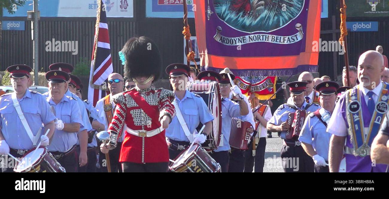 Grab from PA video of an Orange Order parade passing through the ...