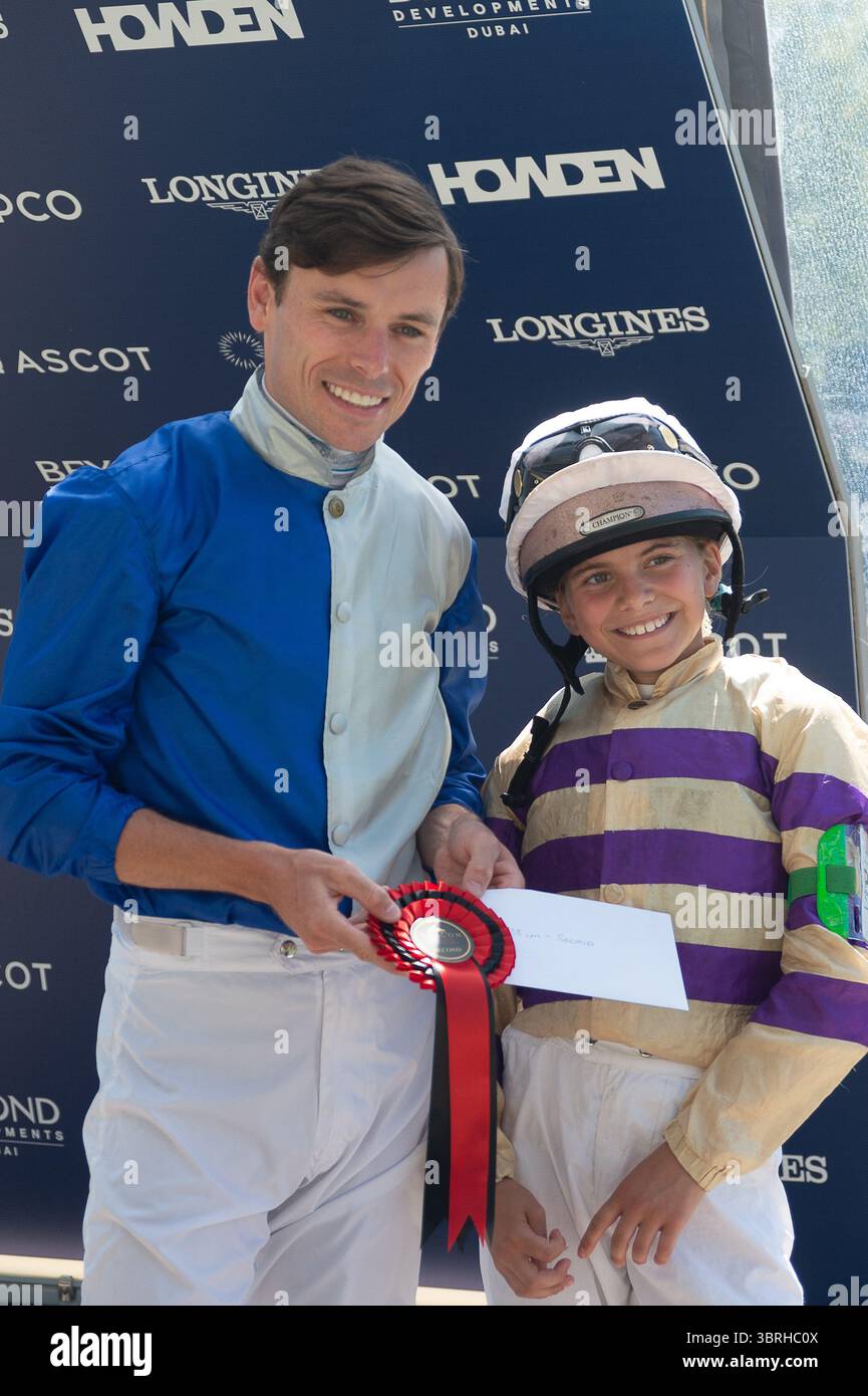 Ascot, Berkshire, UK. 13th July, 2025. Jockey Kieran Shoemark presents ...