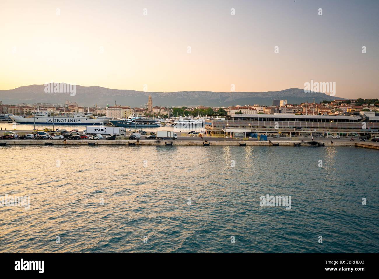 Split, Croatia - June 14, 2025: Port of Split glowing in golden sunset ...