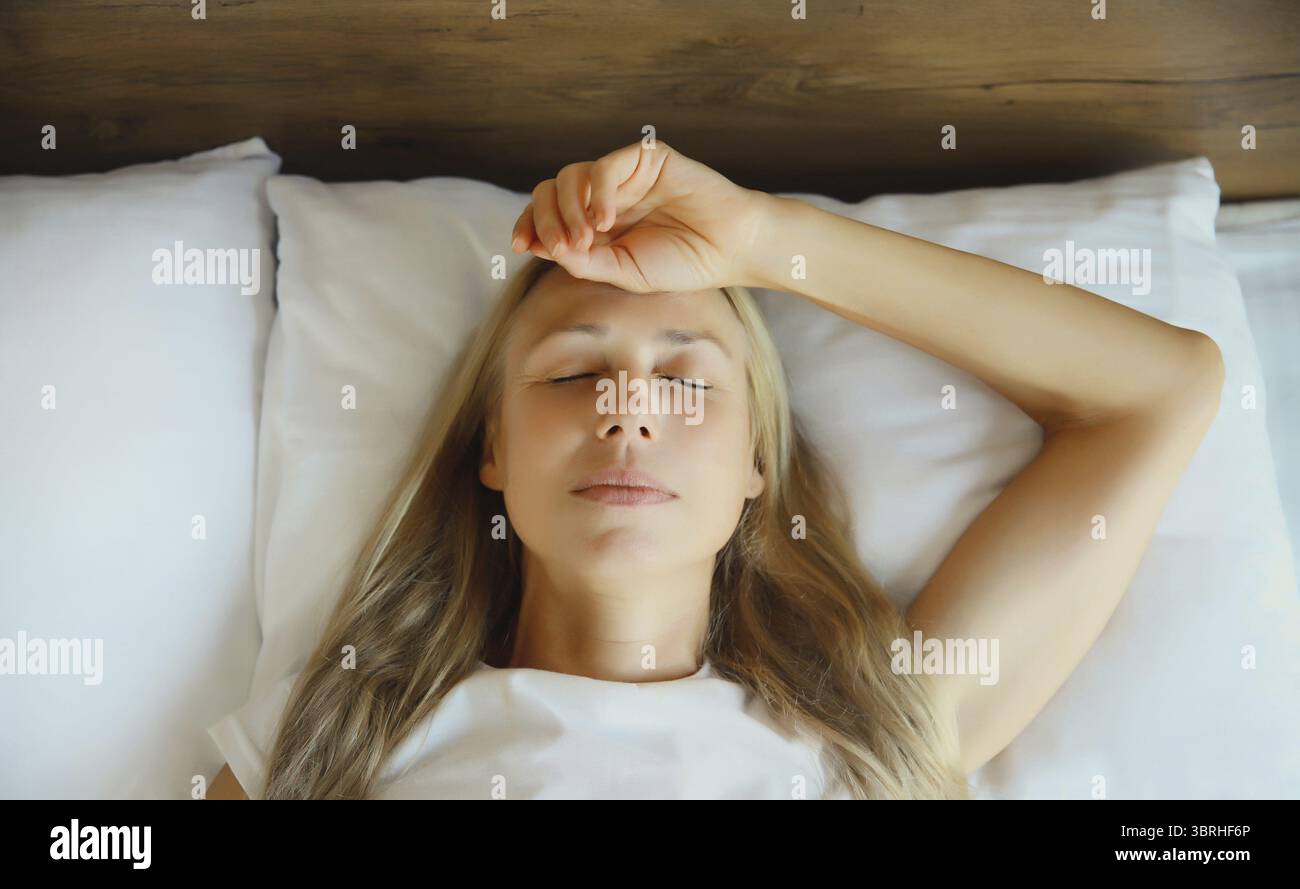 Exhausted tired woman touching head, suffering from headache, stress ...