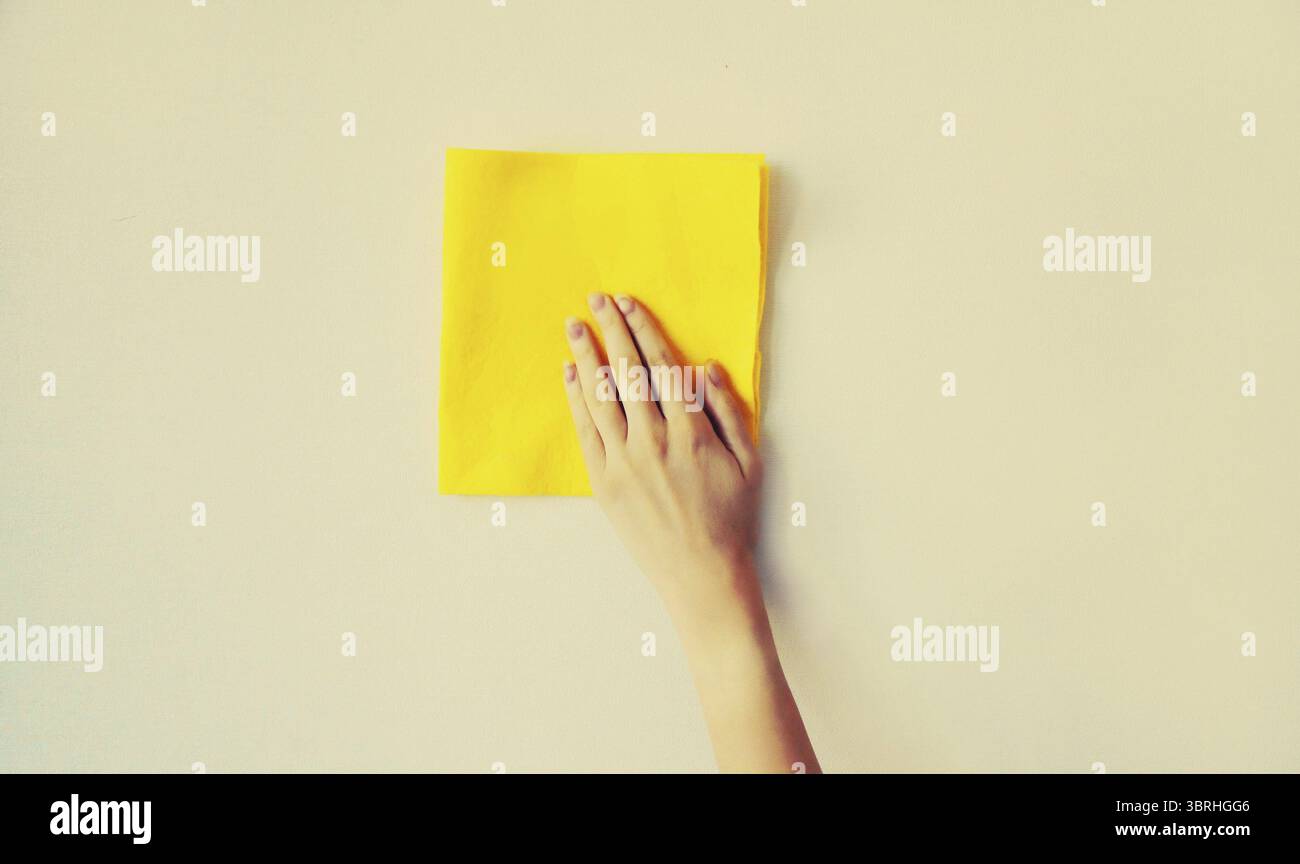 House cleaning concept - woman holding dry microfiber rag wiping the ...