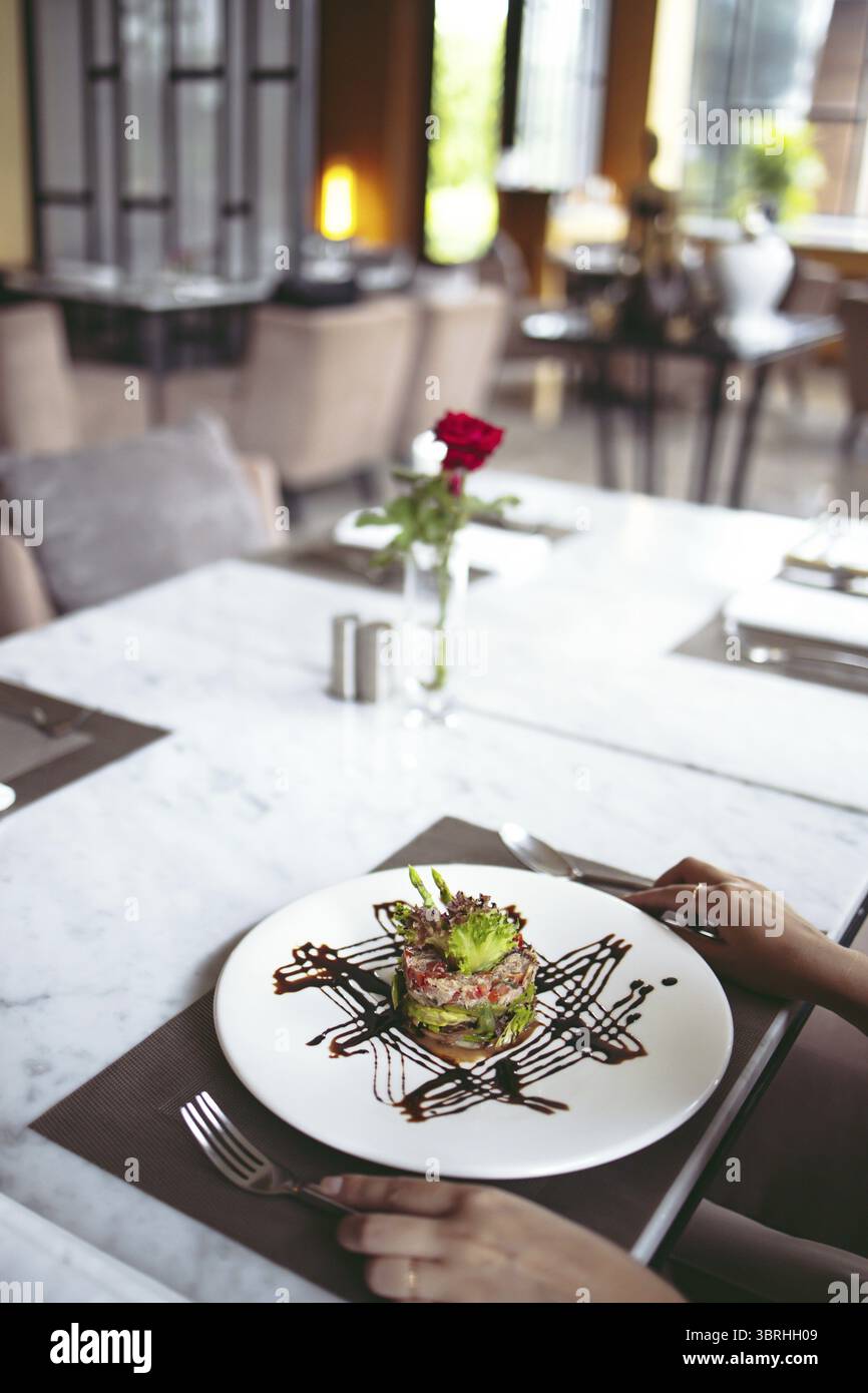 Luxury table settings for fine dining served and decorated table with ...