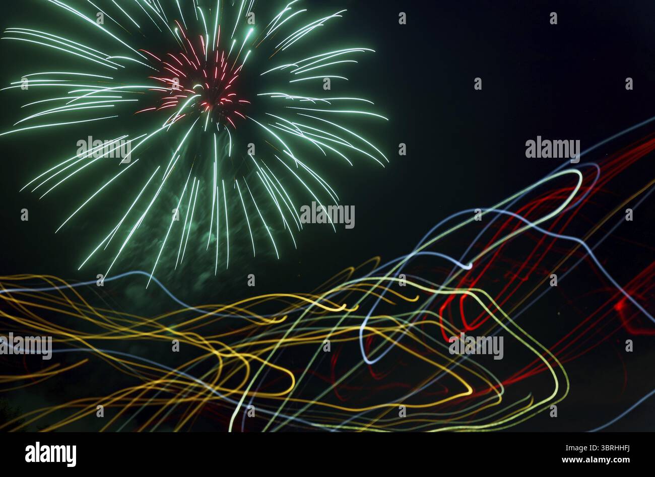 Night fireworks different colors glittering sparkle fireworks on a ...