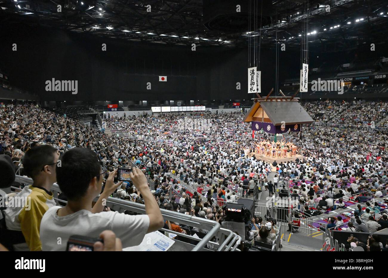 A packed crowd of spectators attends Day one of the Nagoya Grand Sumo ...