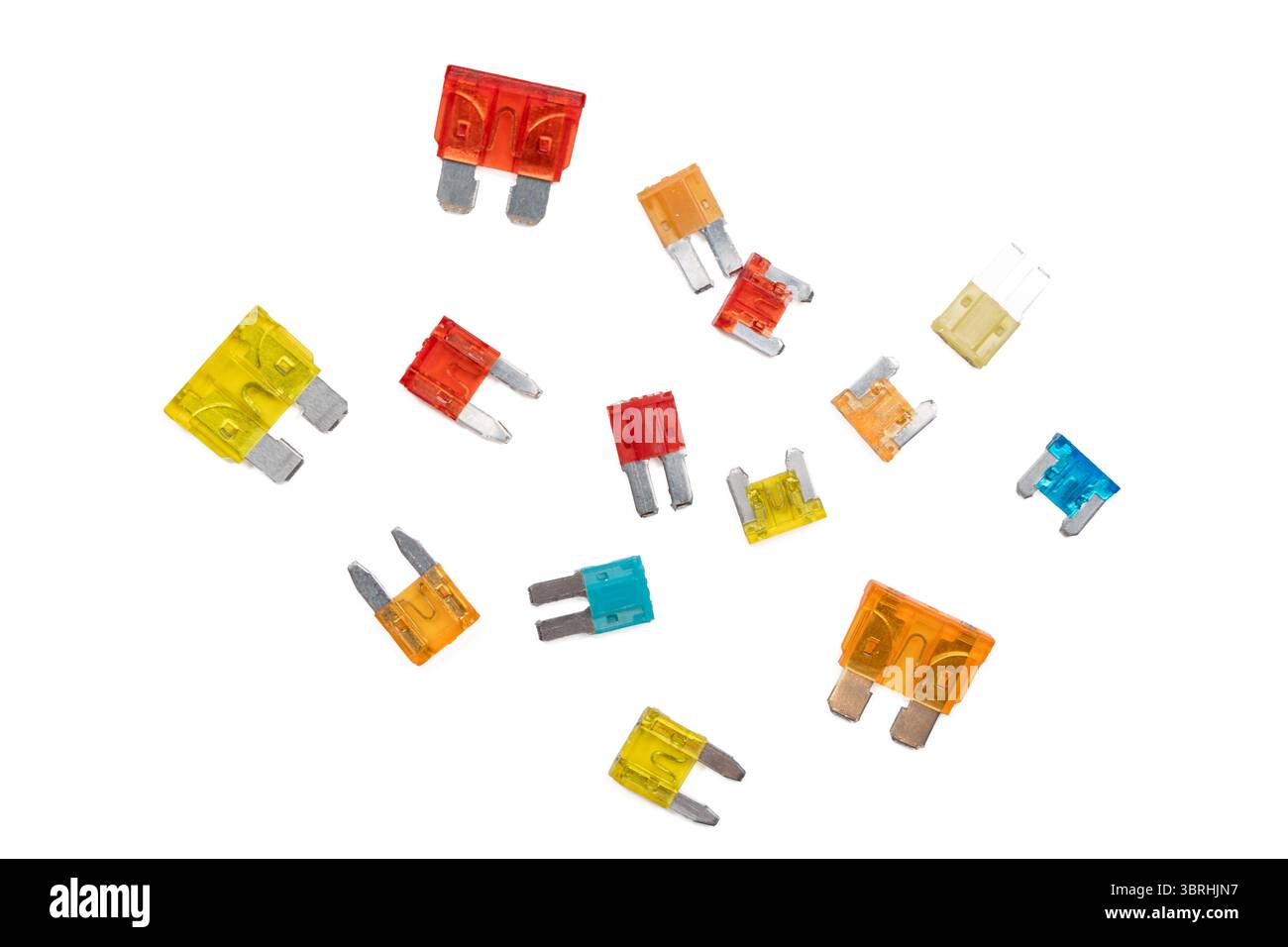 A scattered assortment of colorful blade fuses of different sizes ...