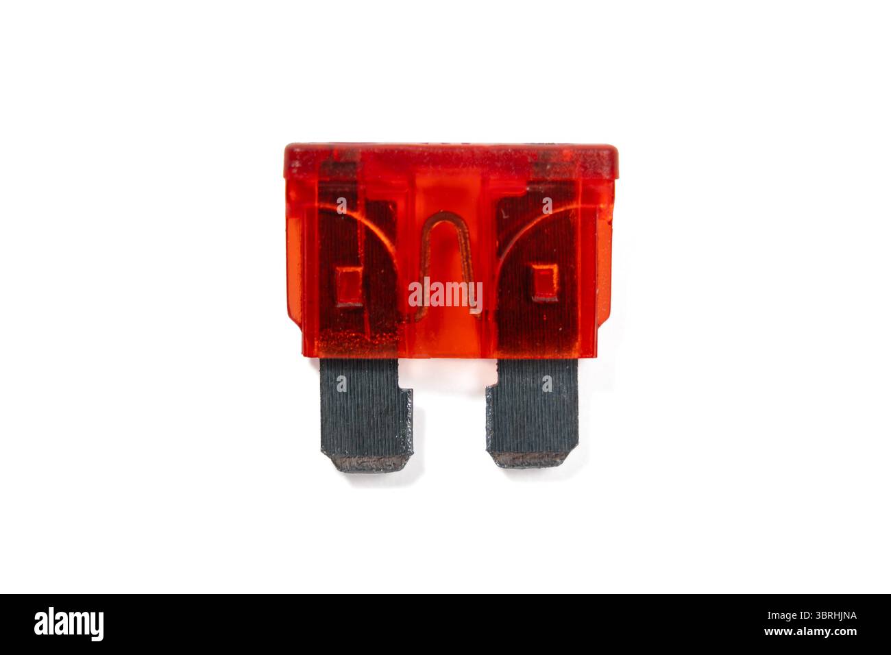 A standard blade fuse with a visible fuse isolated on a white ...