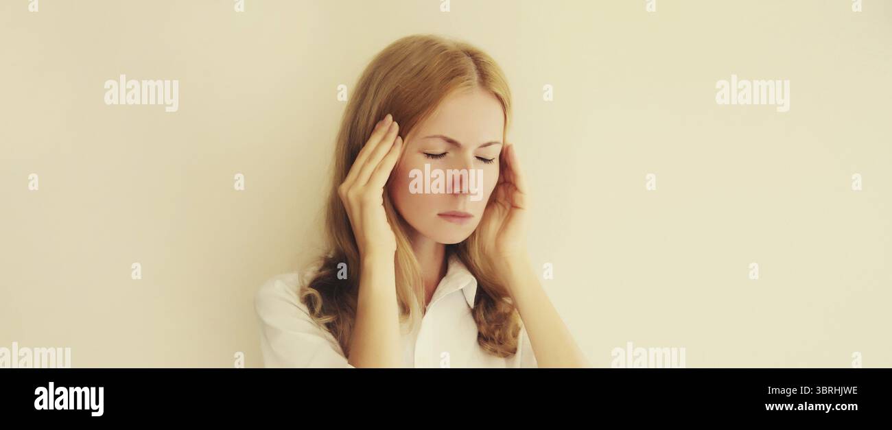 Exhausted tired caucasian young woman employee with headache, stress ...