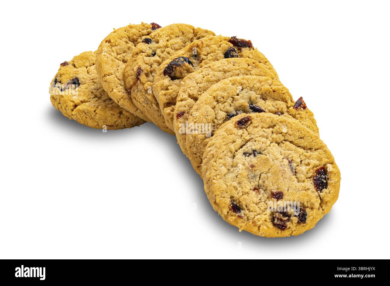 Pile of circular oat flakes and cranberry biscuits isolated on white ...