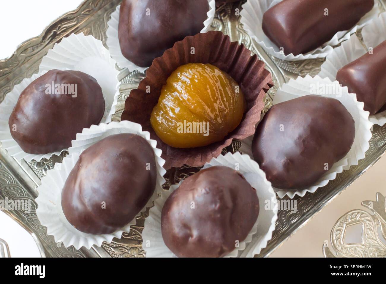 Traditional Turkish Candied Chestnuts in silver tray with chocolate ...