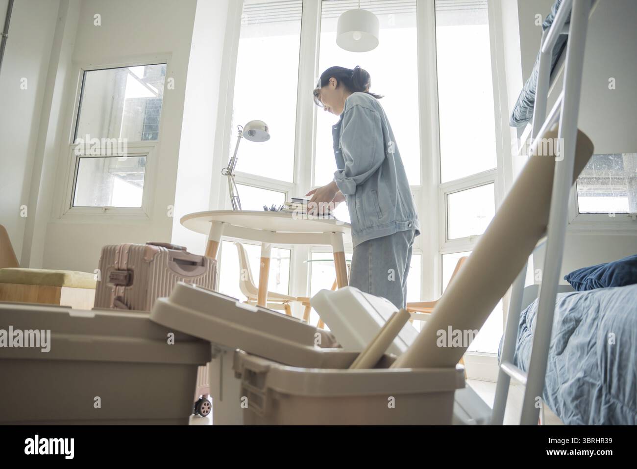 Student asian woman organize room unpack in dorm room college student ...