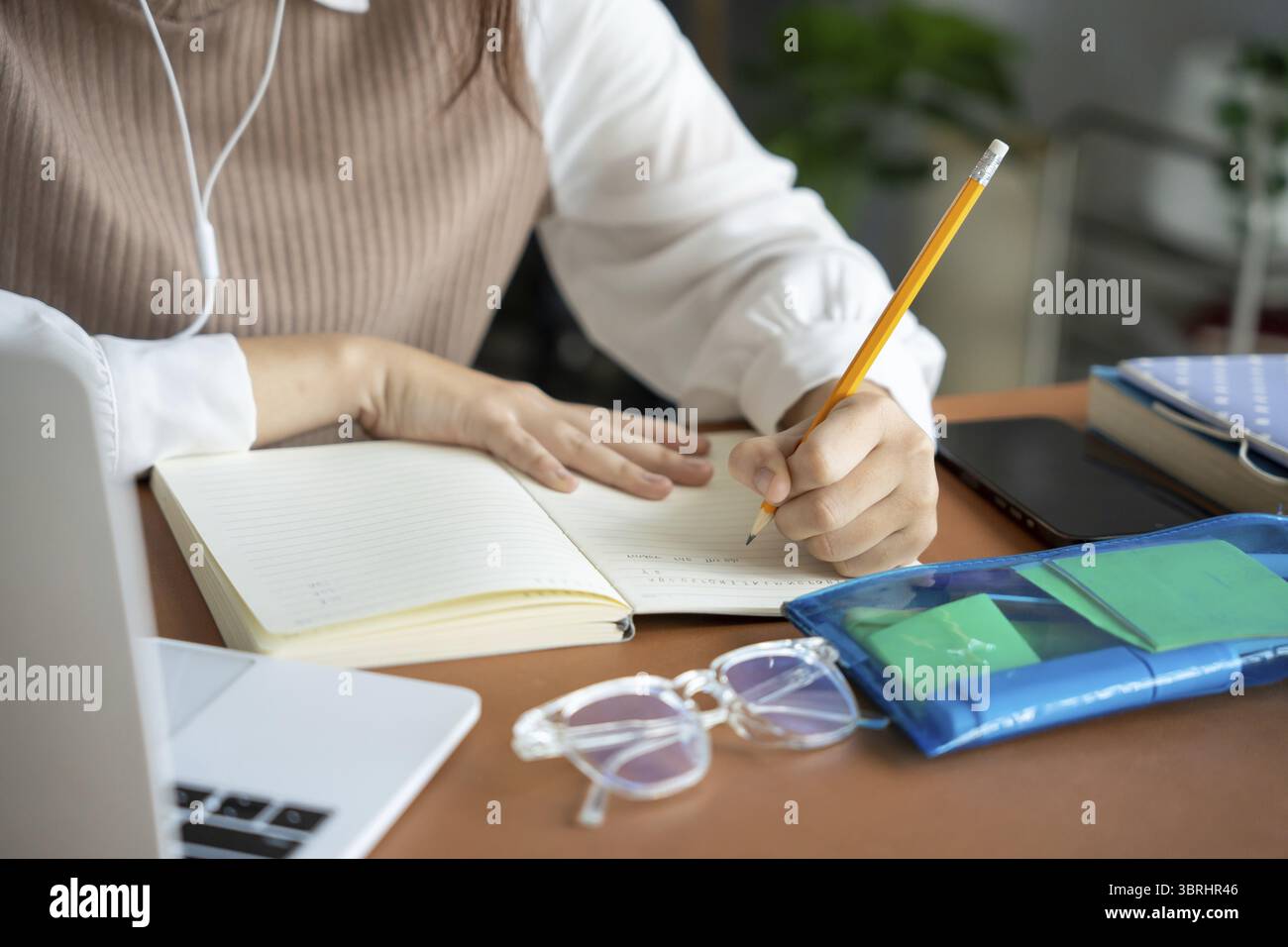 Asian woman learning online class by laptop Stock Photo - Alamy
