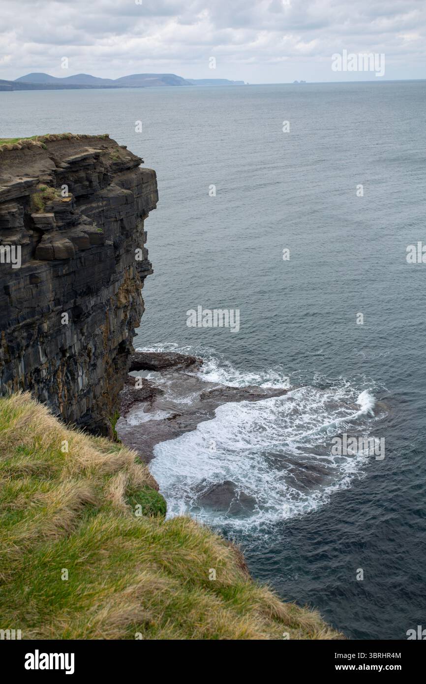 The Majestic Rocky Cliffs Standing Tall Overlooking the Vast Ocean ...