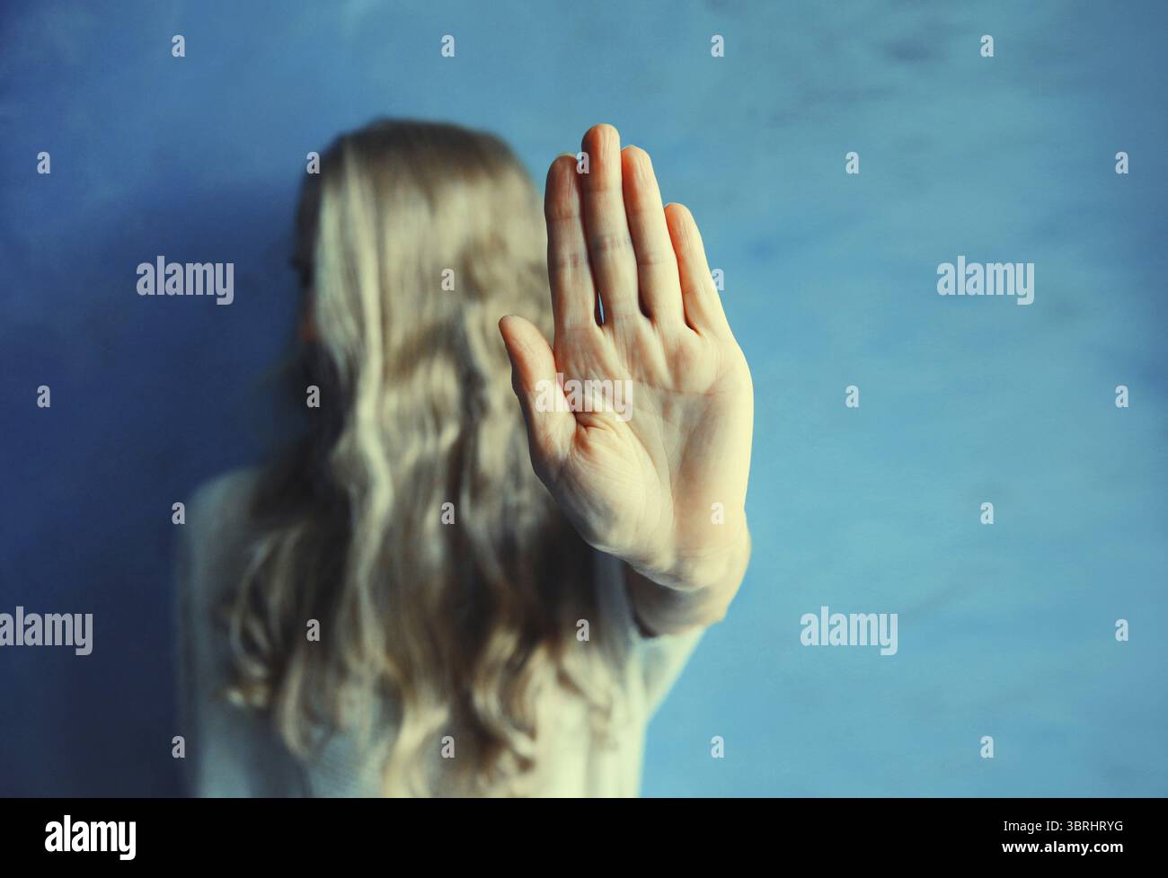 Upset crying middle-aged woman shows stop sign with palm of hand ...