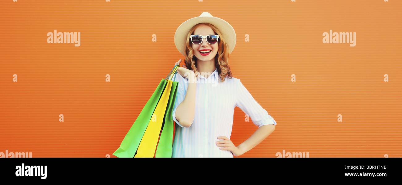 Stylish beautiful happy young woman model with shopping bags in summer ...