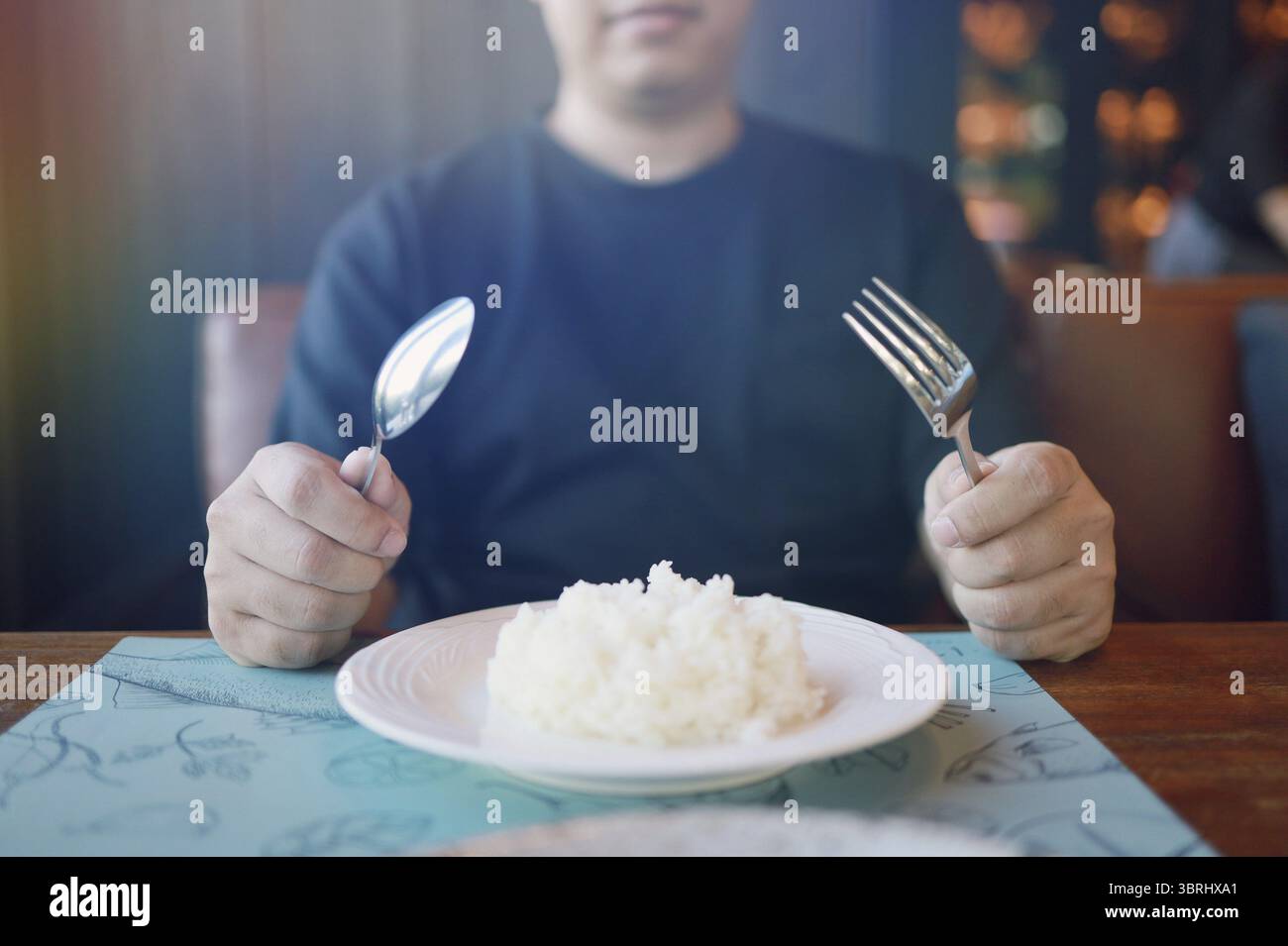 Man eating rice enjoying a meal in restaurant. man having dinner lots ...