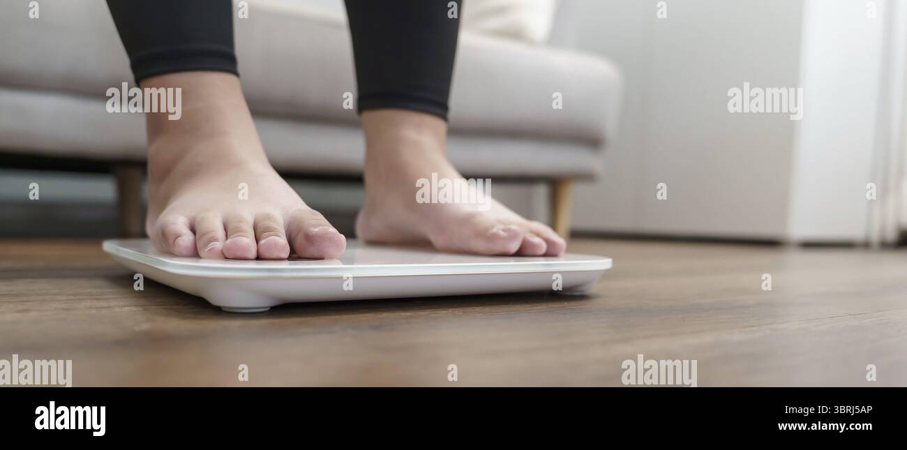 Fat diet and scale feet standing on electronic scales for weight ...