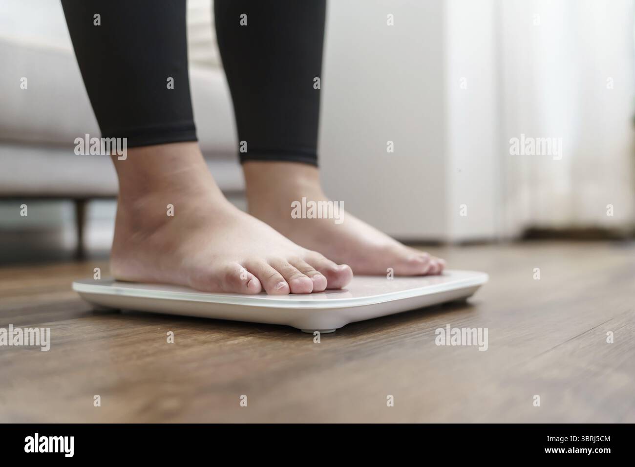 Fat diet and scale feet standing on electronic scales for weight ...