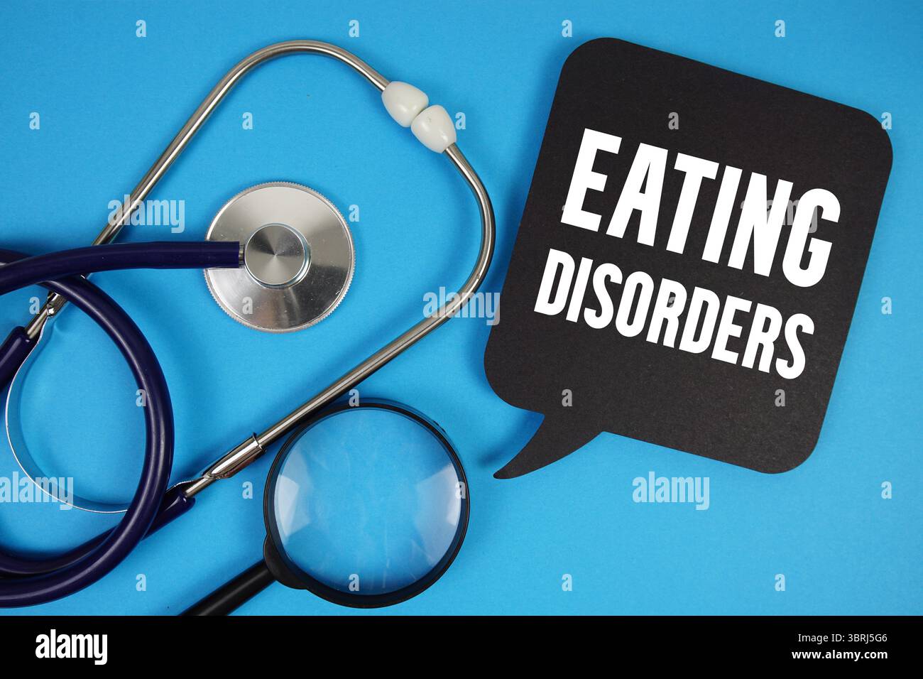 Eating Disorders text with Stethoscope and magnifying glass on blue ...