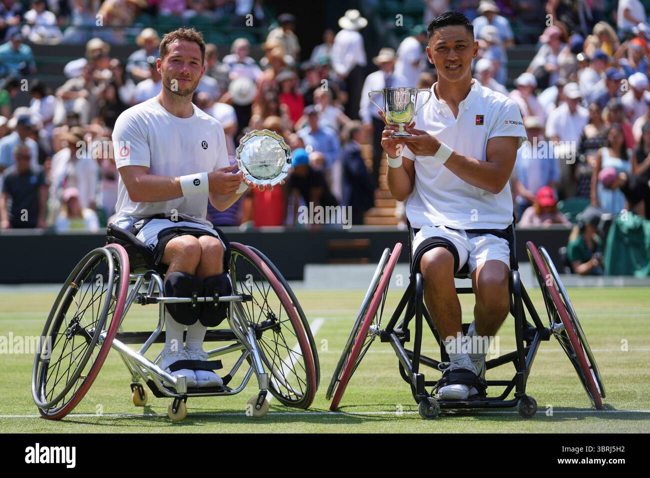 Tokito Oda of Japan and Alfie Hewett of Britain, left, hlod their ...