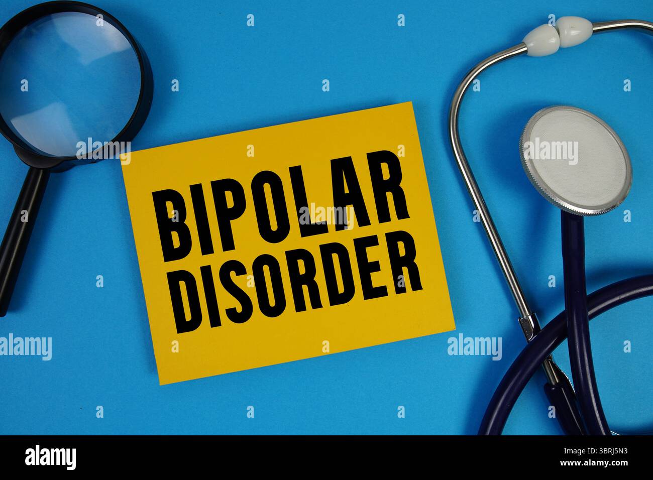 Bipolar Disorder text with Stethoscope and magnifying glass on blue ...