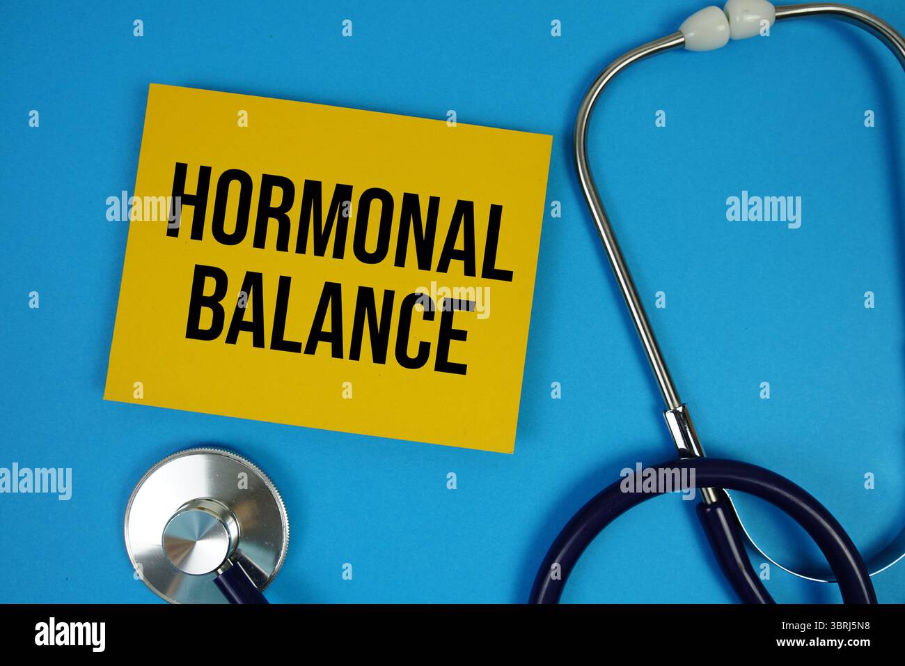 Hormones text with Stethoscope on blue background Stock Photo - Alamy