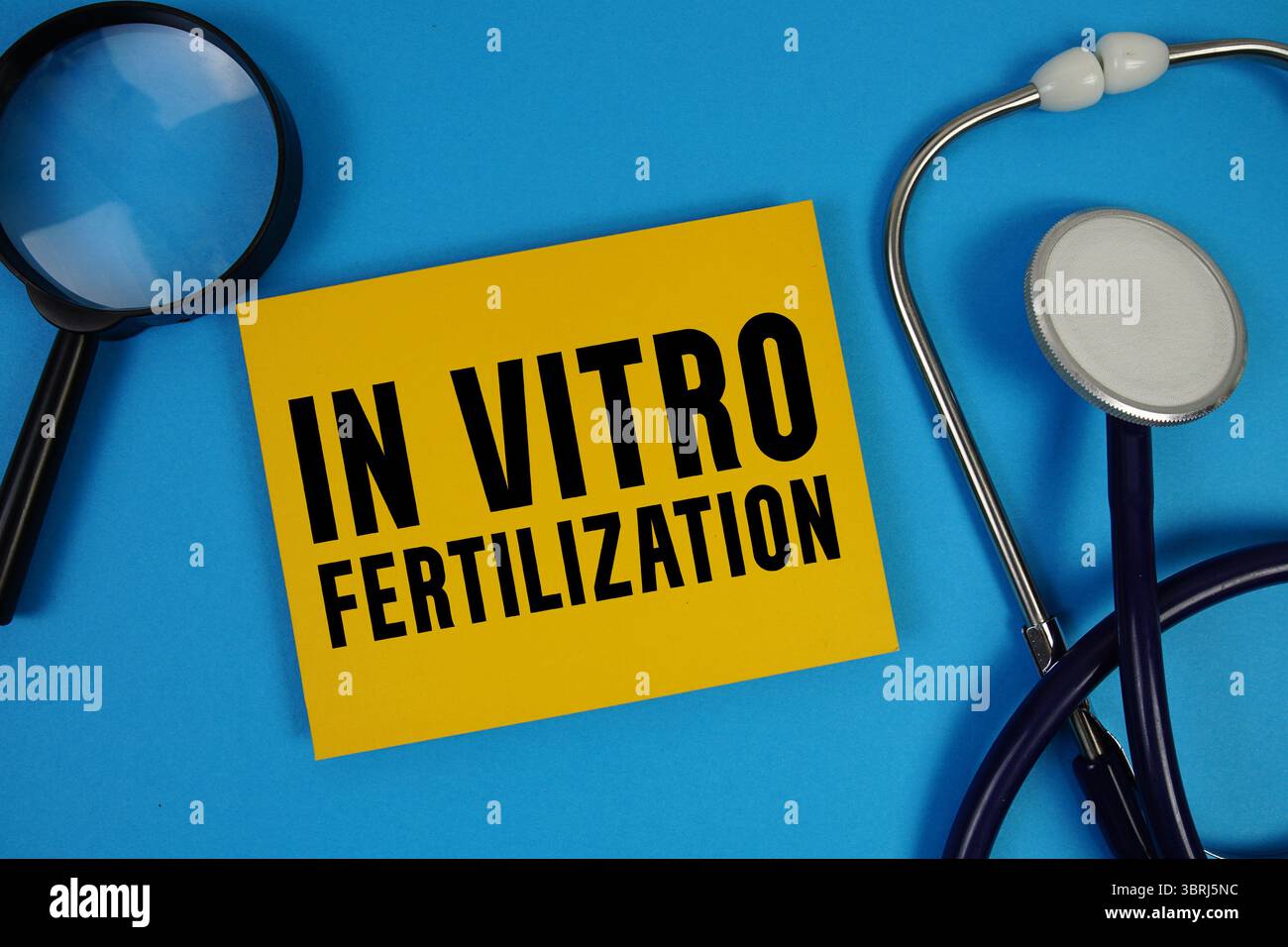 IVF In Vitro Fertilization text with Stethoscope and magnifying glass ...