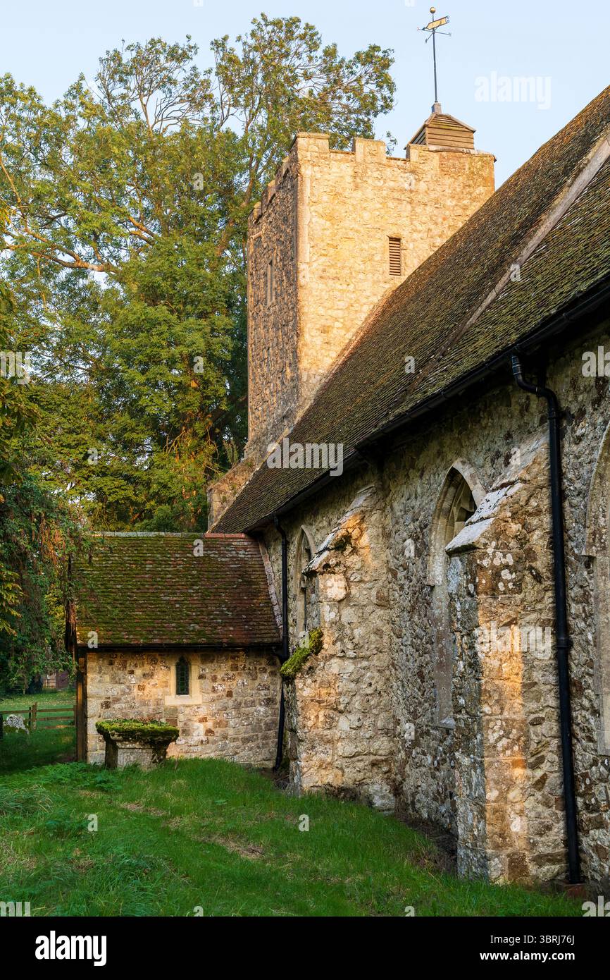 church of St Augustine at Snave in Kent. Early morning golden hour view ...