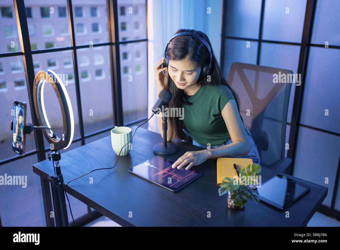 Content creator Young asian woman influencer creating content in home ...