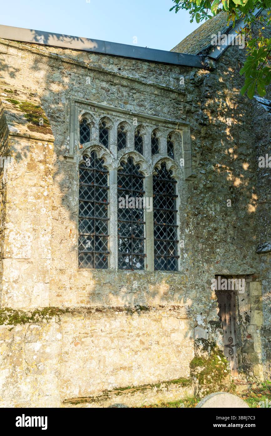 14th century square topped window and the 15th century Priests Door in ...