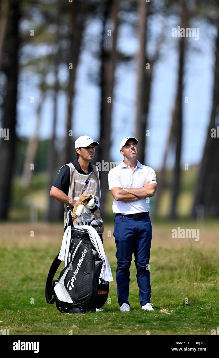 Rory McIlroy (right) with caddie Harry Diamond during day four of the ...