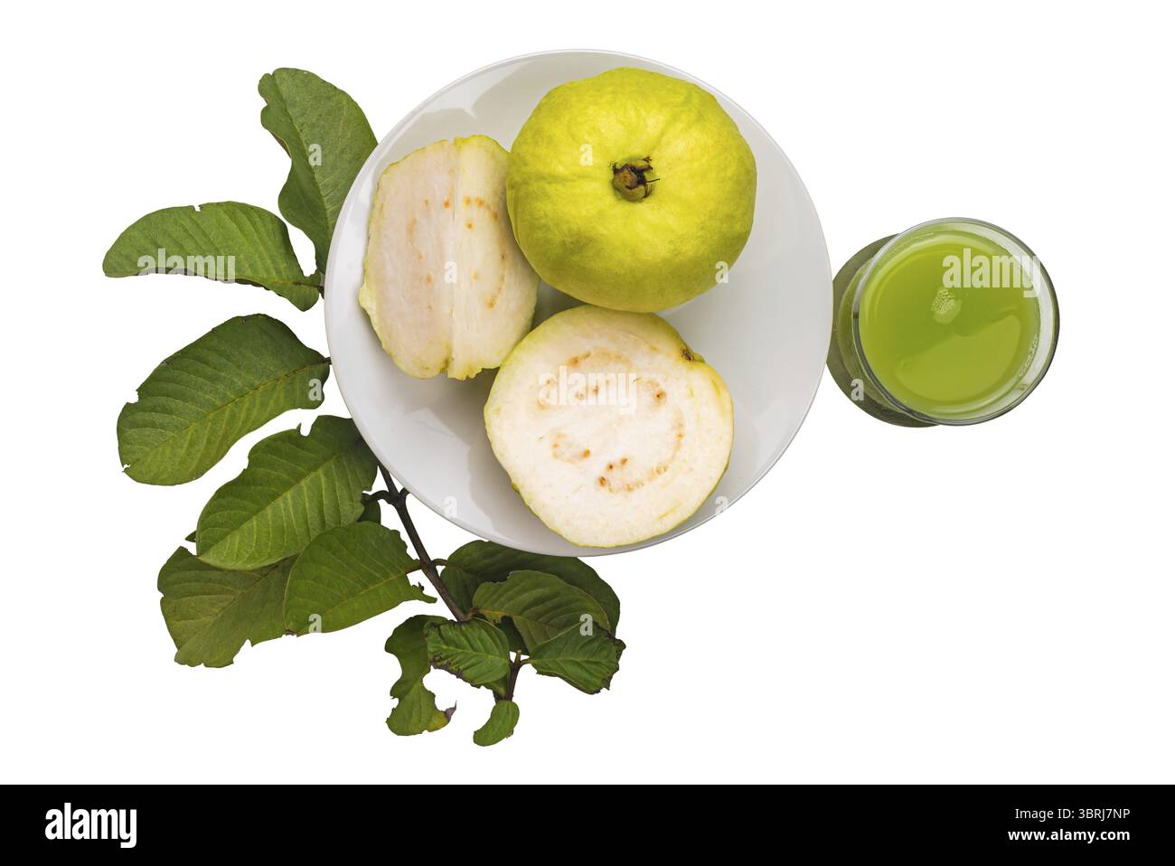 Top view of fresh guava juice in transparent glass with ripe guava ...