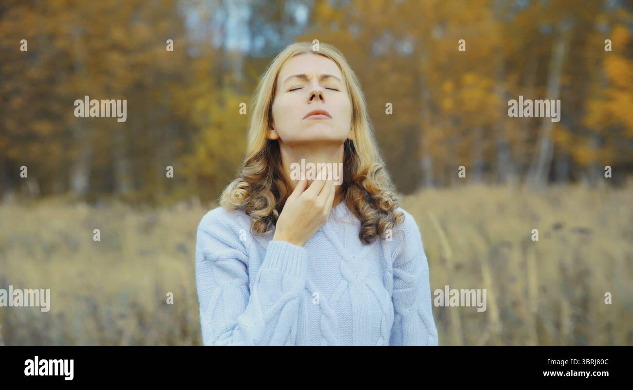 Sick exhausted young woman suffering from acute sore in throat flu ...