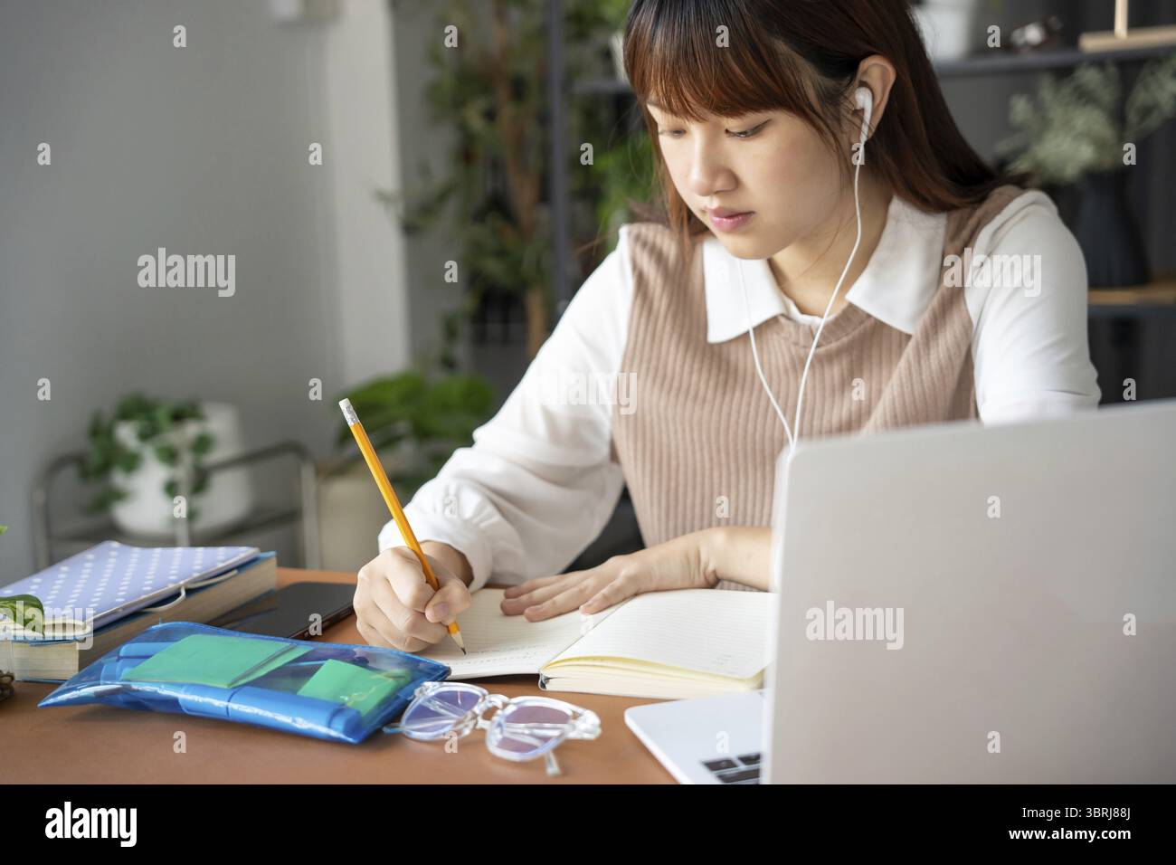 Asian woman learning online class by laptop Stock Photo - Alamy